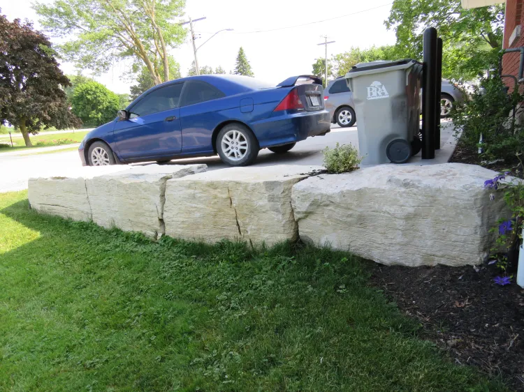 Weatheredge Limestone Armor Stone Retaining Wall Beside Driveway in ...